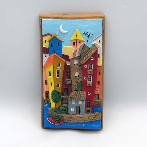 Ceramic tile with landscapes in relief