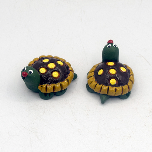 Ceramic turtle miniature in red clay.